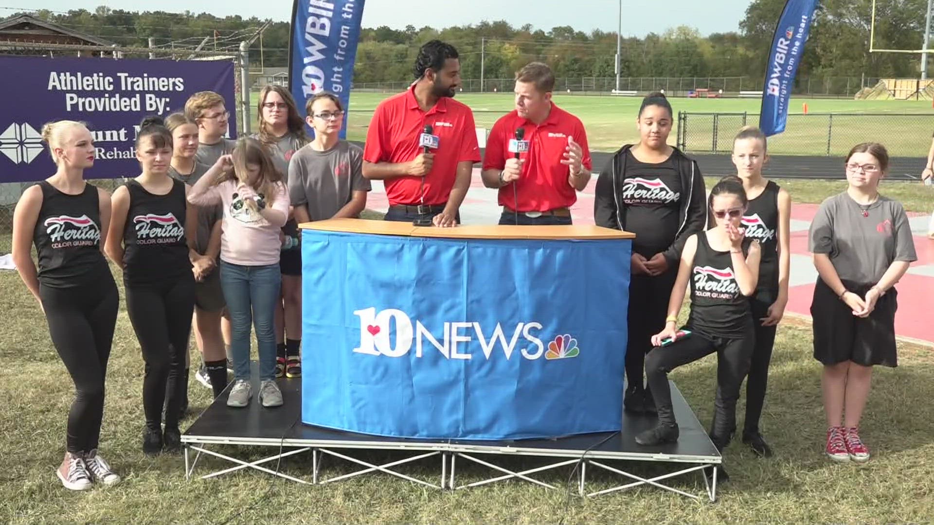 Heritage Middle School Color Guard marches with the high school band ...