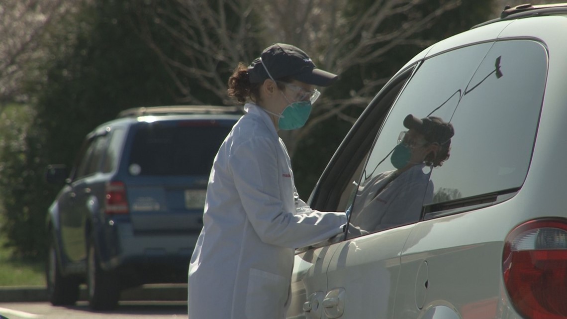 Local pharmacy vaccinates hundreds of people at drive-thru clinic ...