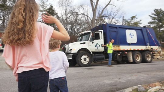 Little boy surprised by his heroes, the garbage men | wbir.com