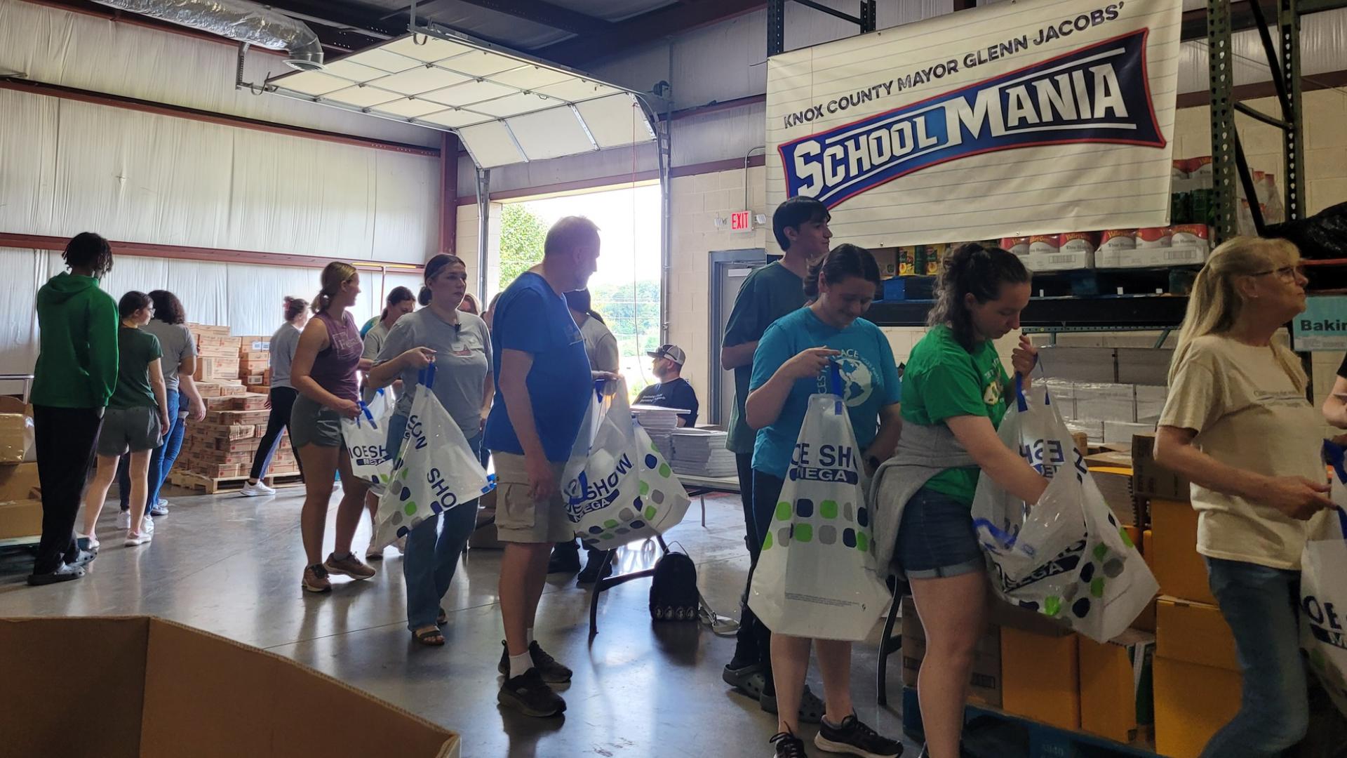 Knox County Mayor helps prepare for annual 'School Mania' back-to-school event, aiming to pack ...
