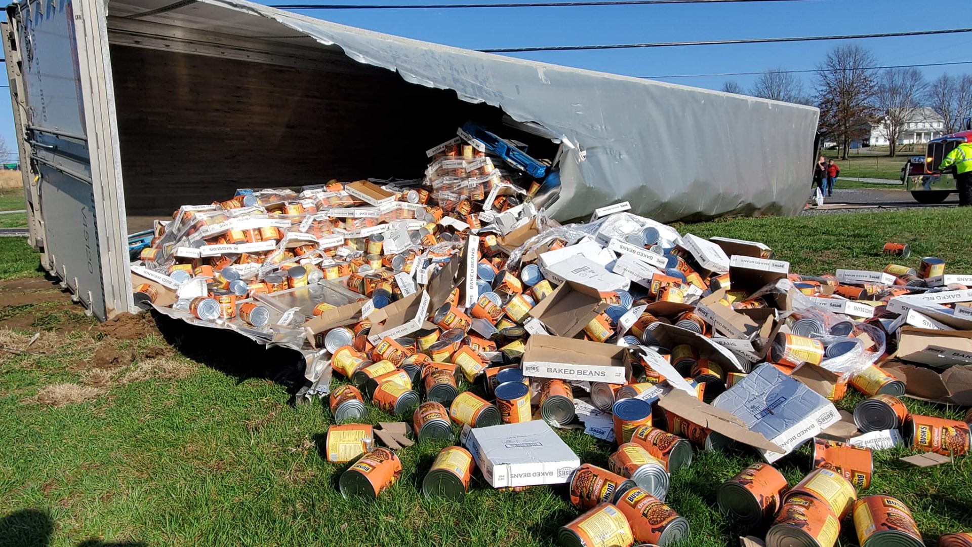 Spilling the beans: Truck full of baked beans flips on Newport Highway ...