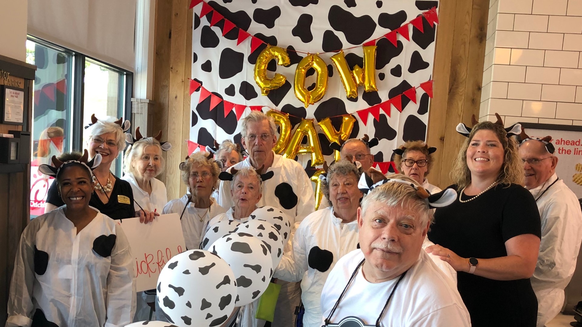 Seniors celebrate Cow Appreciation Day at Chick-fil-A by donning their ...
