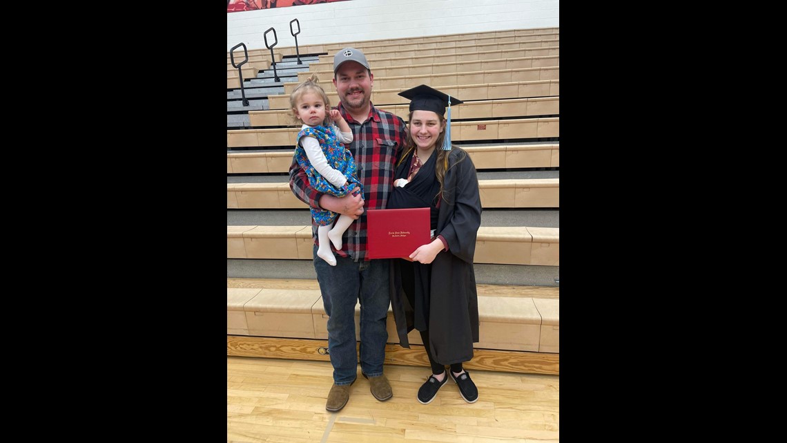 Woman walks in graduation with newborn baby | wbir.com